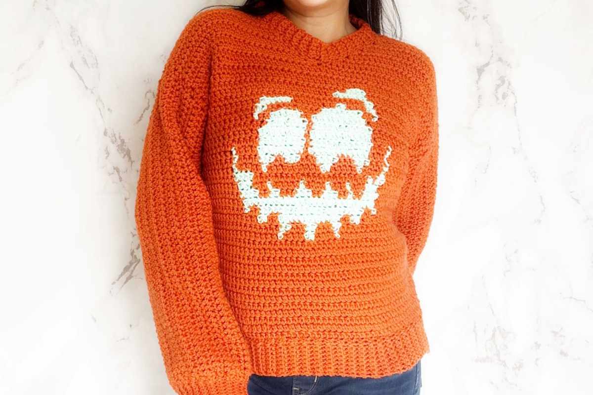 Glowing Pumpkin Face Sweater to Crochet This Fall